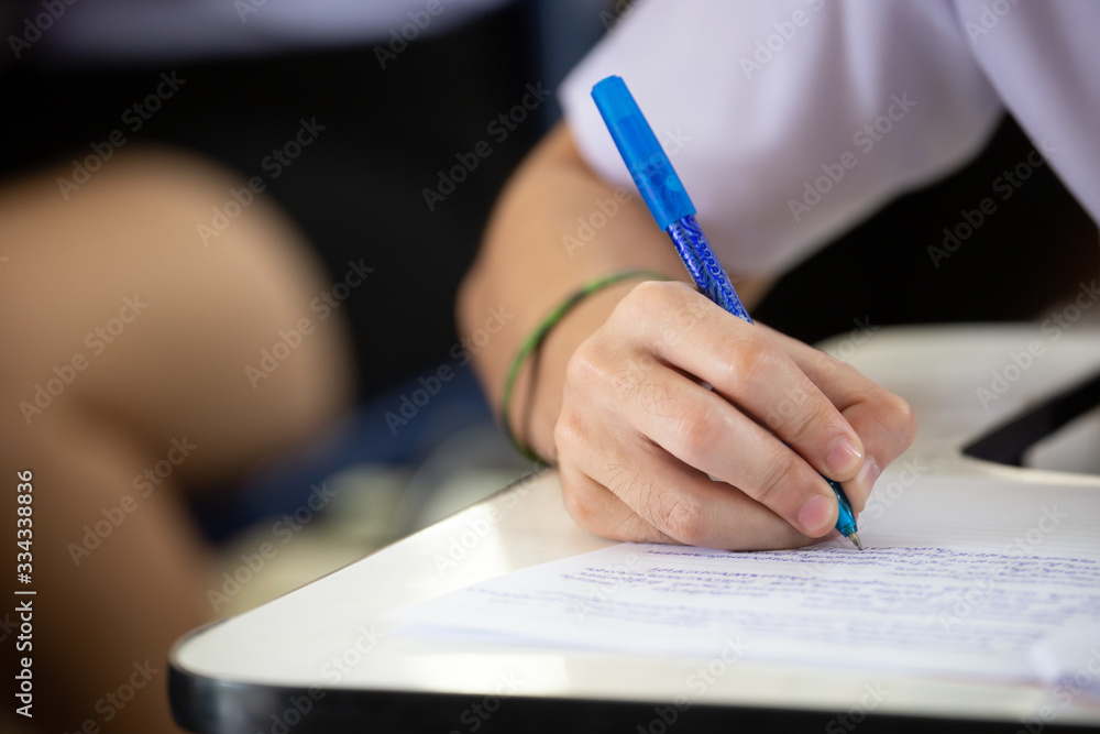 high school,university student study.hands holding pencil writing paper ...
