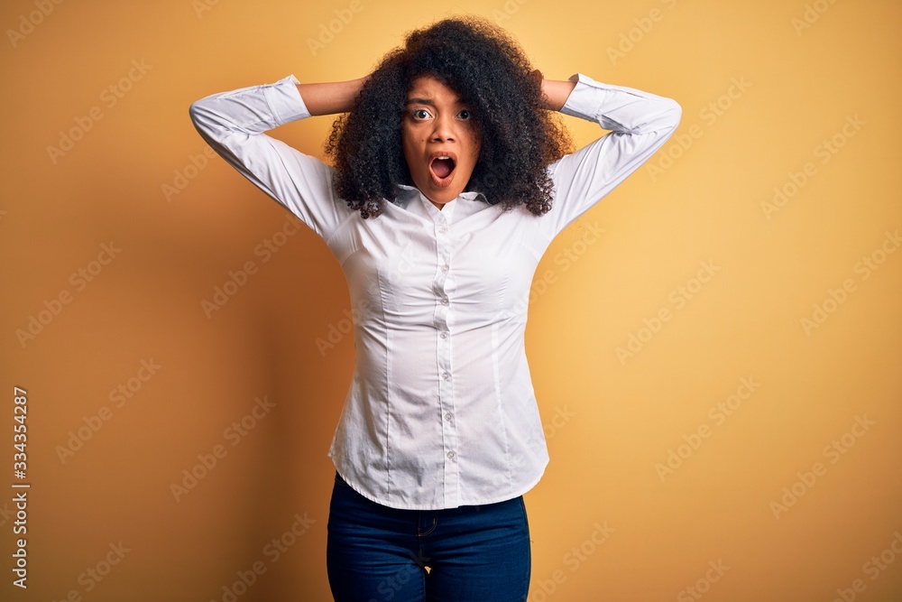 Young beautiful african american elegant woman with afro hair standing ...