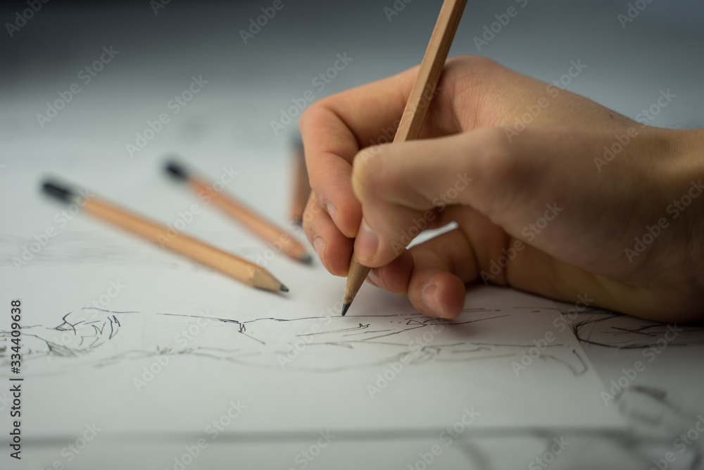 Drawing the human figure with a pencil Stock Photo | Adobe Stock