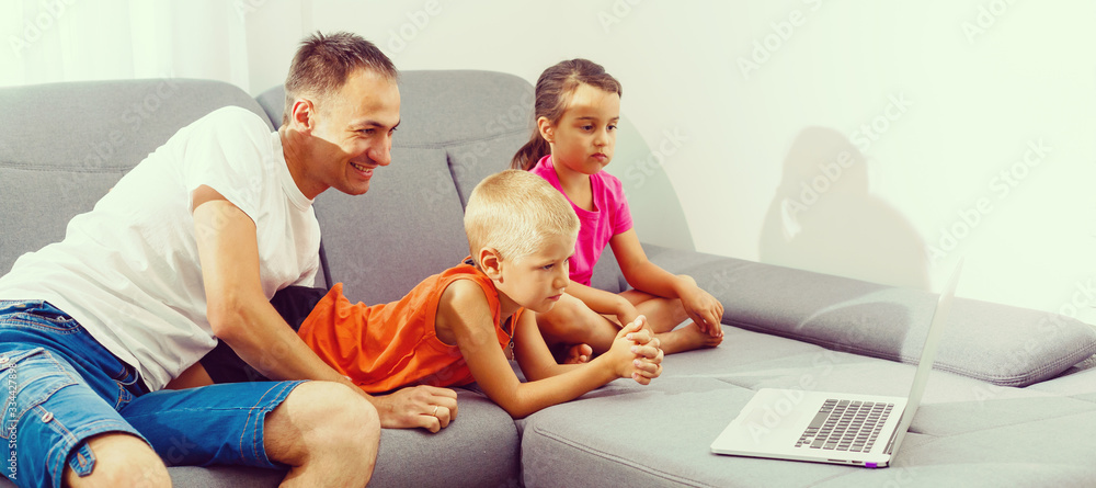 Children and their father using a Laptop, online learning at home Stock ...