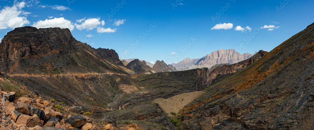 Mountain and valley view along Wadi Sahtan road and snake canyon in Al ...