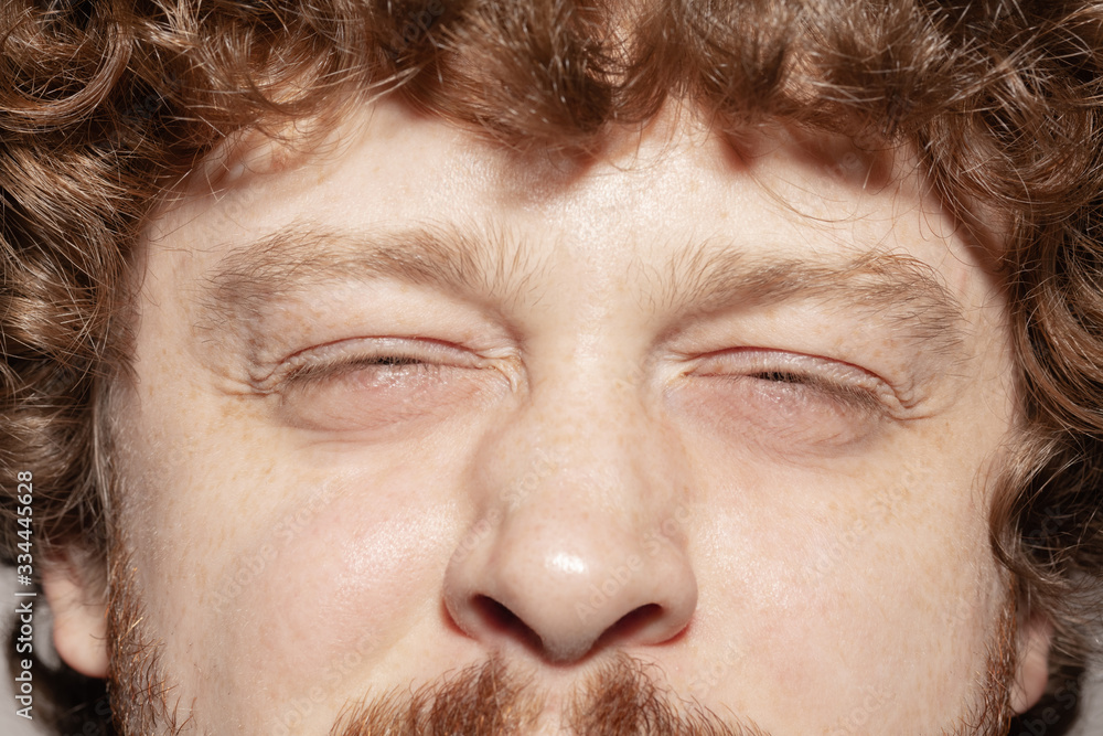 Looking suspects. Close up of face of beautiful caucasian young man ...