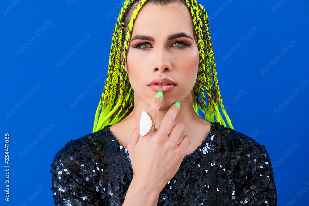 Portrait of young transgender woman on color background Stock Photo ...