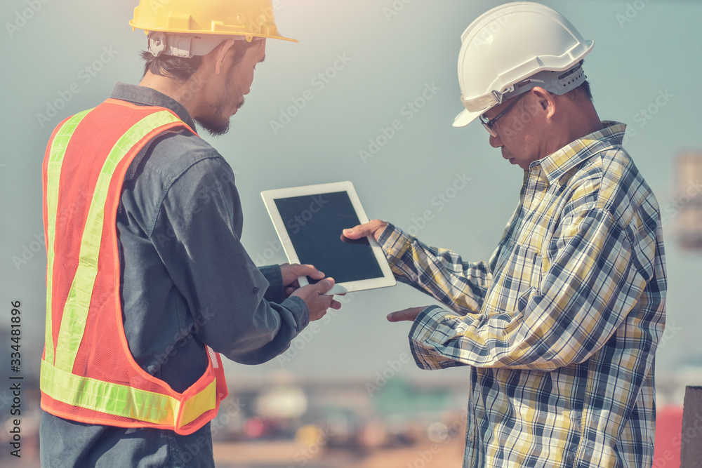 Engineering holding tablet work on road construction Stock Photo ...