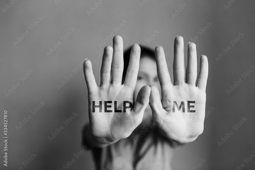 Stop domestic violence. The girl covers her face with her hand and asks ...