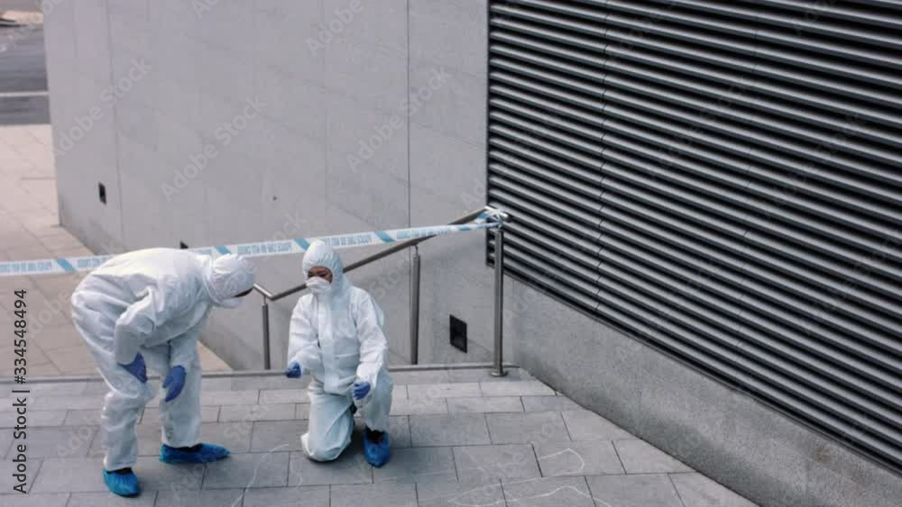 Forensic science team working on police investigation site Stock ビデオ ...