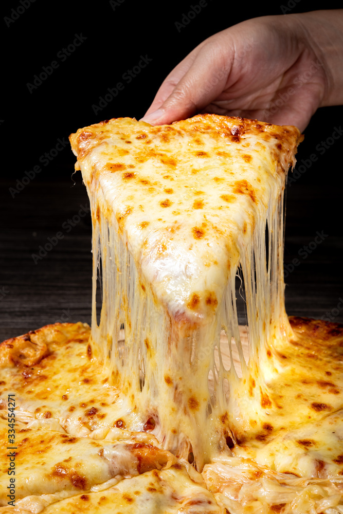 Stretched cheese pizza Stock Photo | Adobe Stock