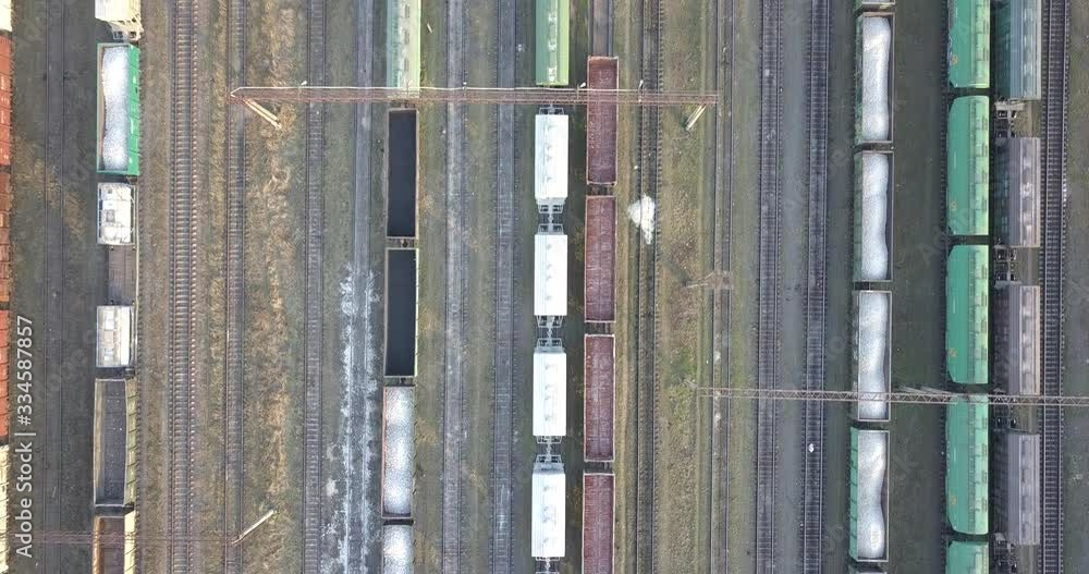Cargo trains close-up. Aerial view of colorful freight trains on the ...