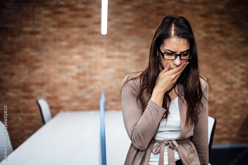 Business woman in empty office having emotional mental problems ...