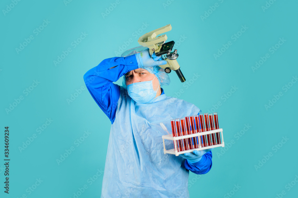 Science, biology and medicine concept. Doctor analyzing blood sample in ...