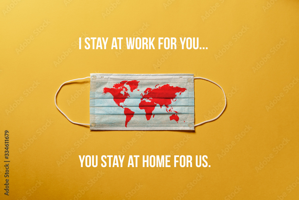 Surgical mask with a red map of the world, with message "STAY AT HOME ...