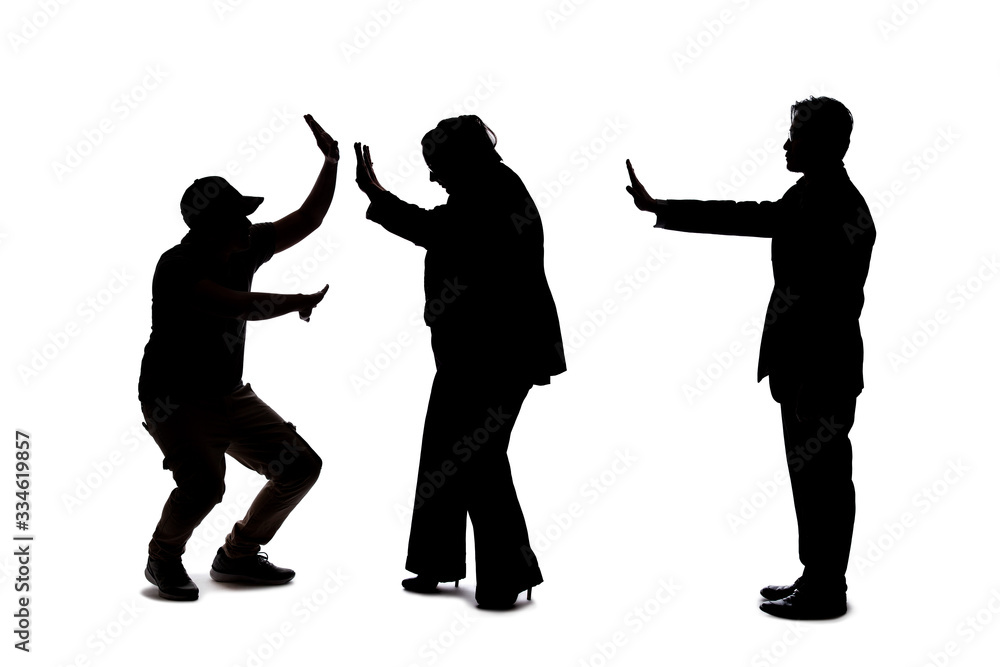 Silhouette of a group of people practicing social distancing which is ...