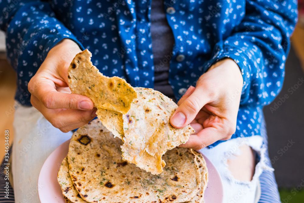 Plain flatbread stuffed with herbs. Indian traditional chapati, naan ...
