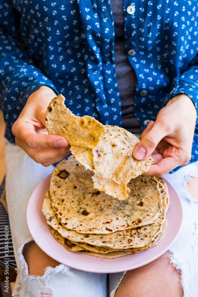 Plain flatbread stuffed with herbs. Indian traditional chapati, naan ...