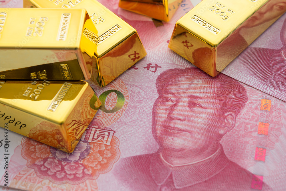 Gold bars on Chinese yuan bill banknotes background. Concept of gold ...