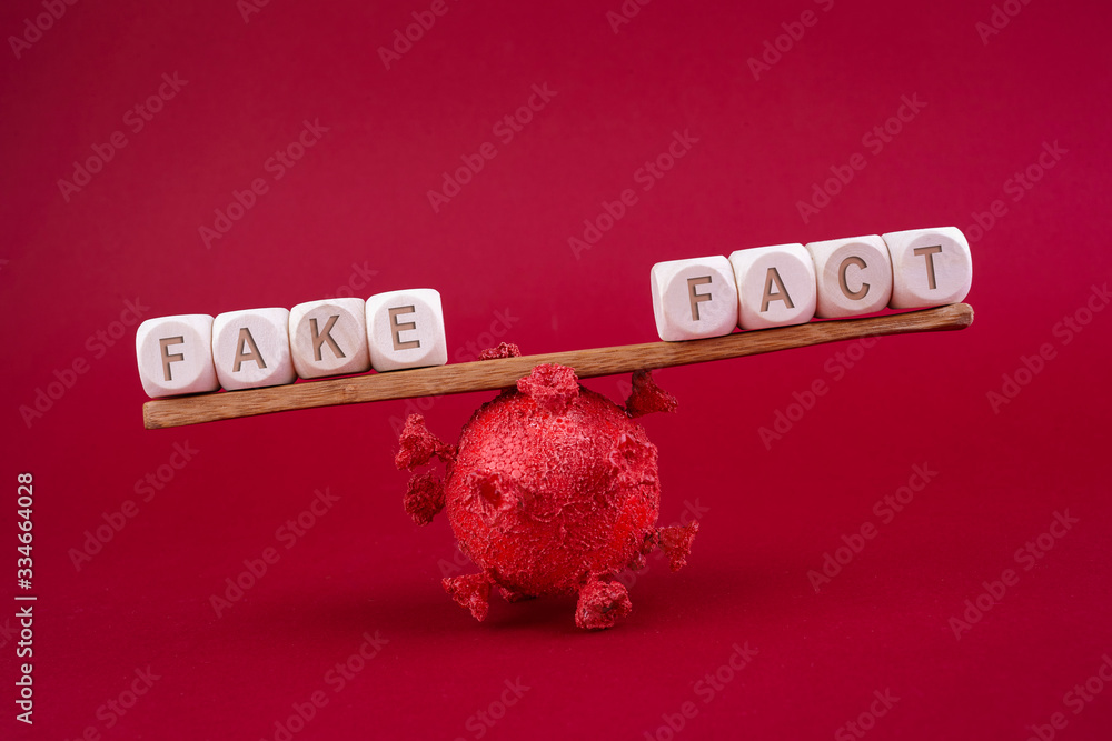 Social media concept. Corona virus fake news concept. Scale on red ...