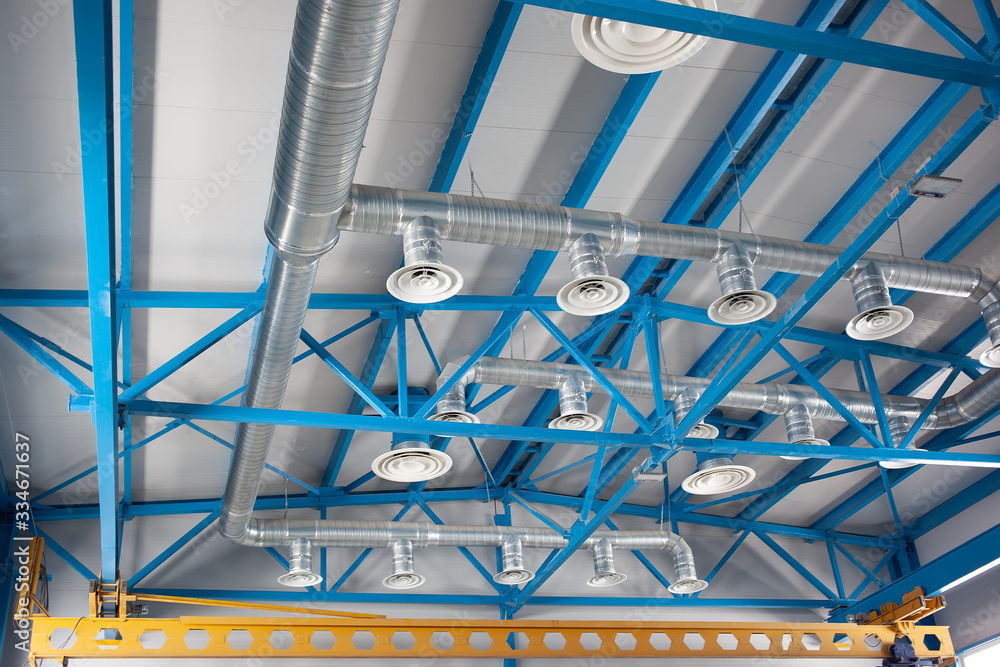 Ventilation system on the ceiling of large buildings. Ventilation pipes ...
