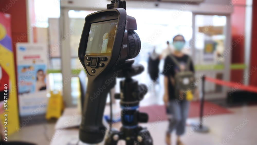 Temperature check at a supermarket, grocery store with a thermal ...