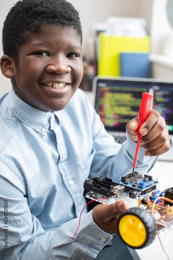 Portrait Of Male High School Pupil Building Robot Car In Science Lesson ...
