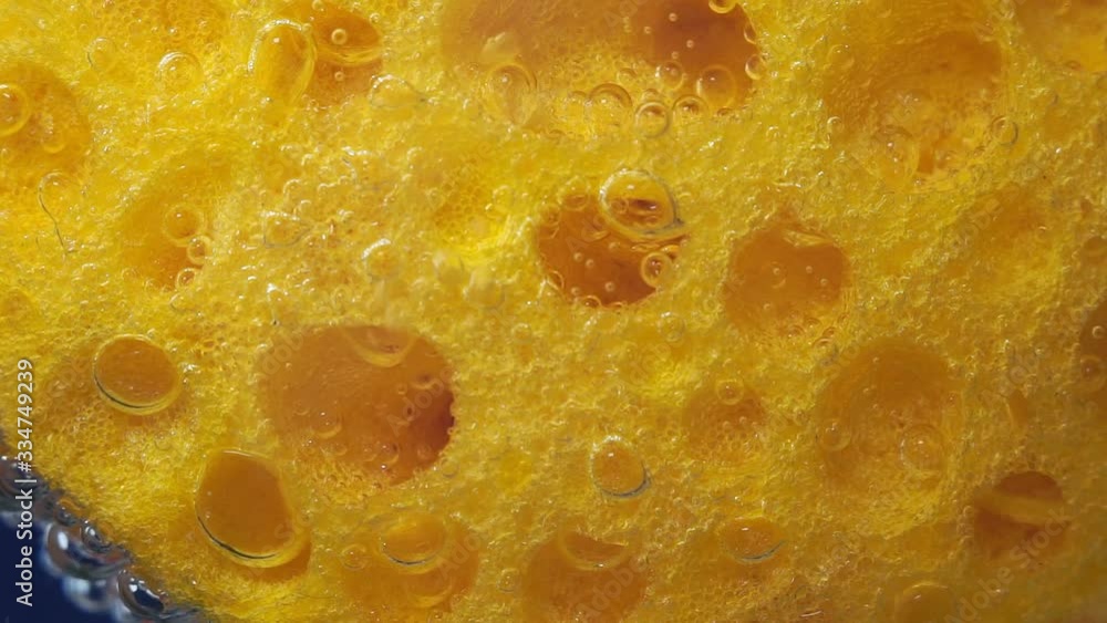 dishwashing sponge close up in water under water. concept of washing ...