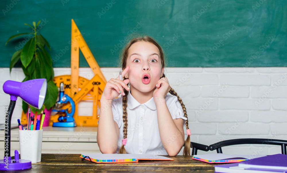 Girl cute child sit school classroom chalkboard background. Small kid ...