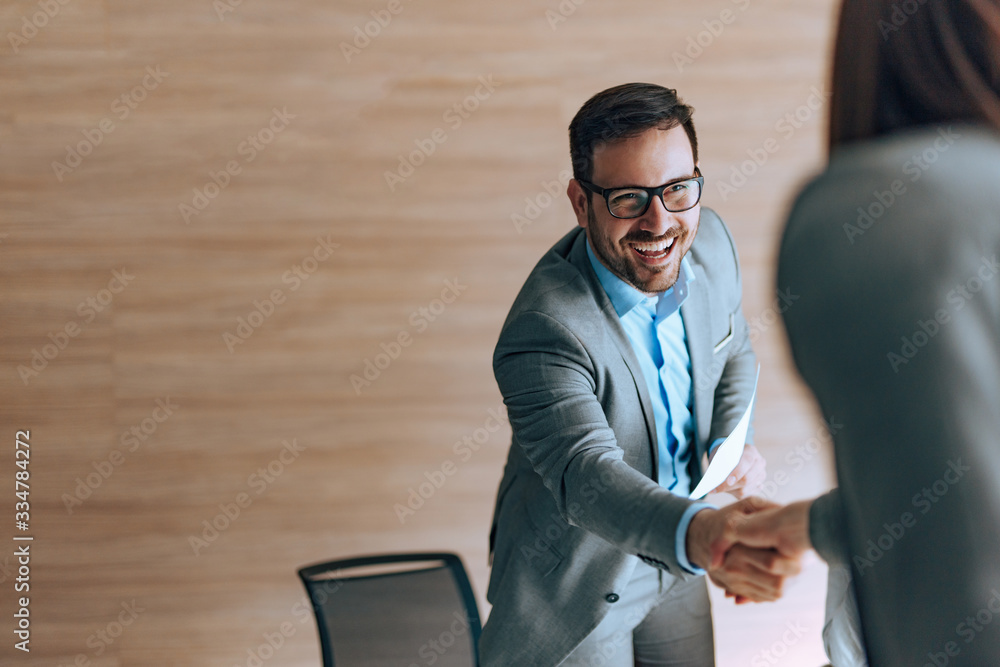Foto de Manager handshake with job applicant, portrait, copy space. do ...