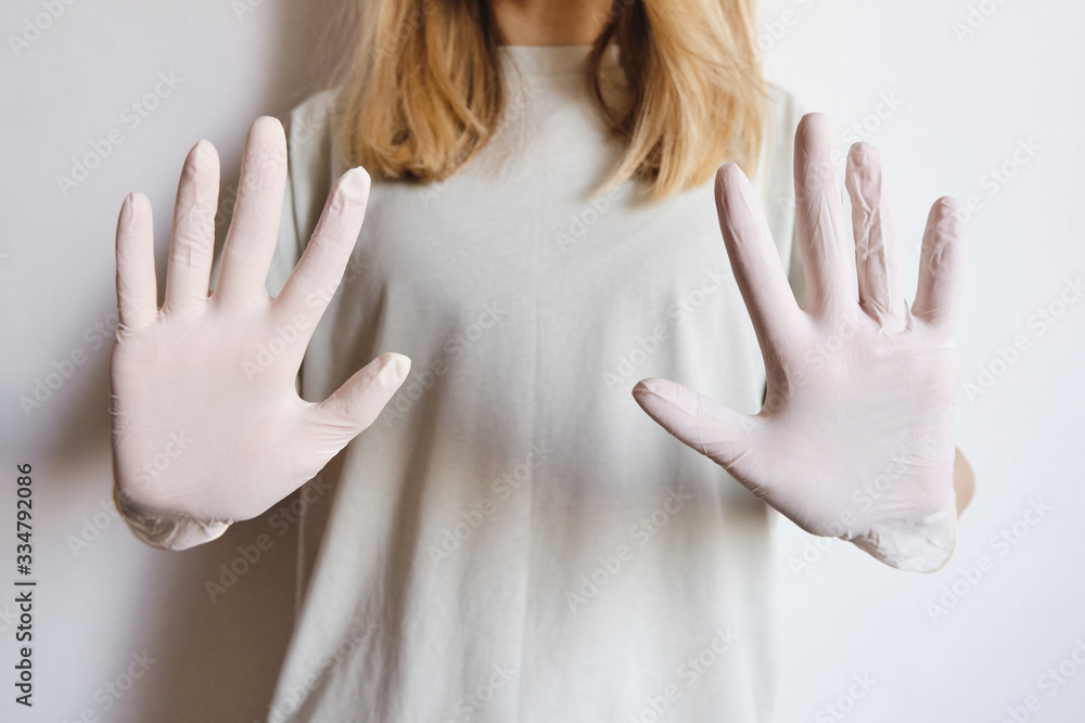 Woman's hands in medical gloves closeup. Protecting the body from ...