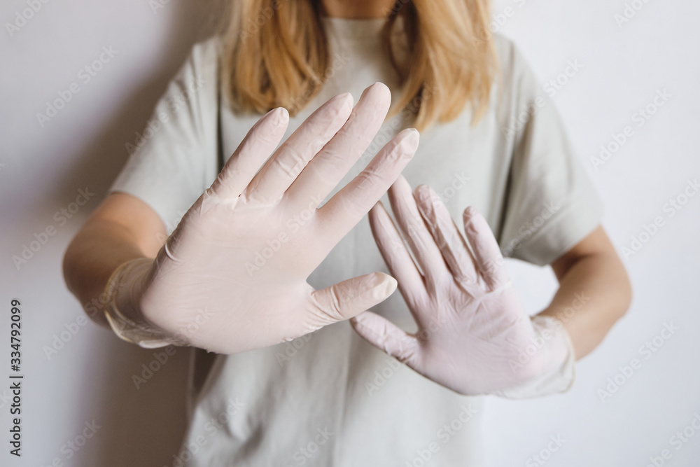 Woman's hands in medical gloves closeup. Protecting the body from ...