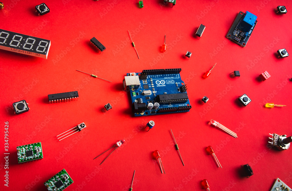 Arduino UNO board and components red background Stock Photo | Adobe Stock
