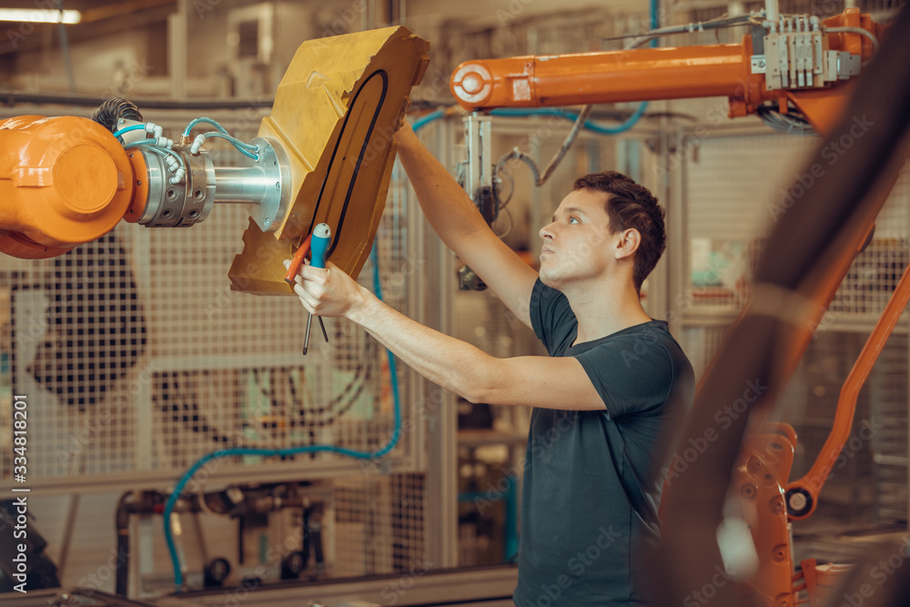 preparing a robot for the production of a new type of cars in the ...