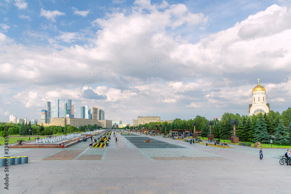 The town square with flower beds is surrounded by a beautiful park ...