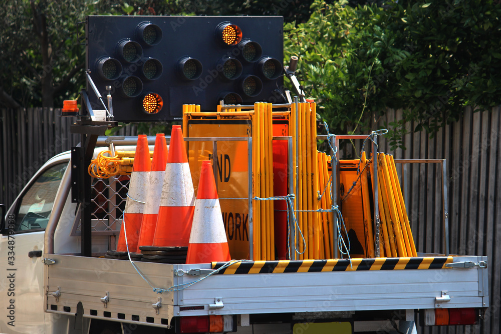 Road construction companies vehicle. The ute loaded with traffic ...