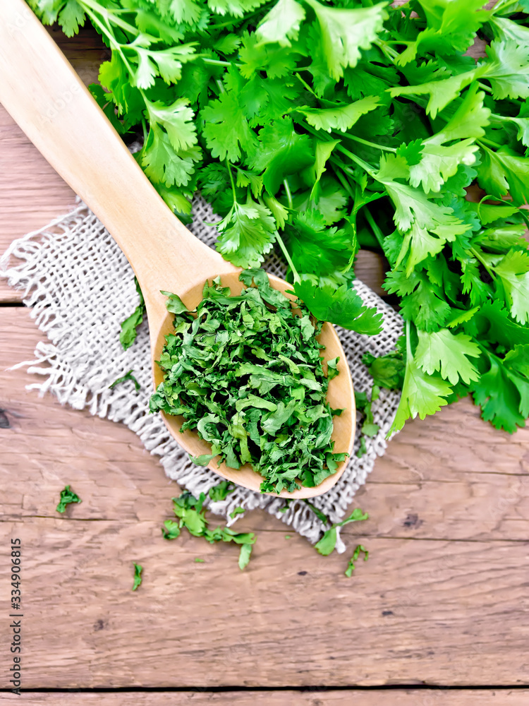 Cilantro dried in spoon on board top Stock Photo | Adobe Stock