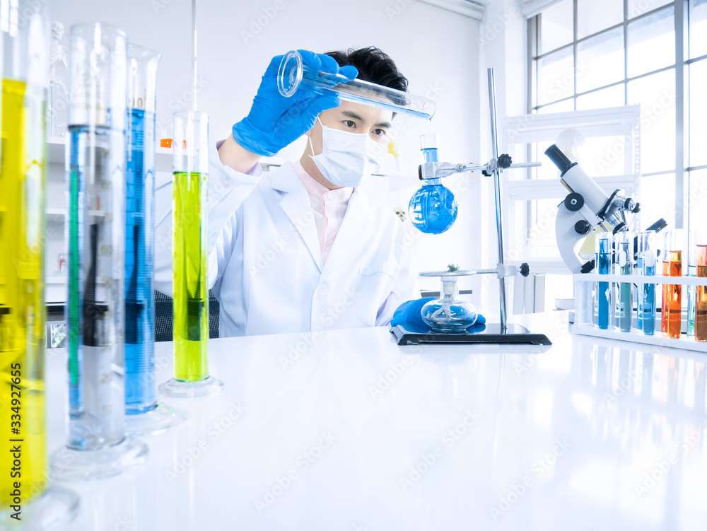 Asian professional scientist man wear surgical mask for test virus ...