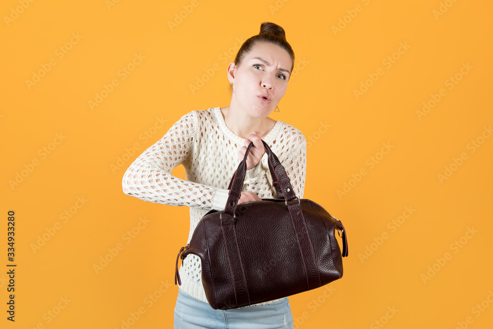 girl pulls something out of a woman s handbag with effort Stock Photo ...