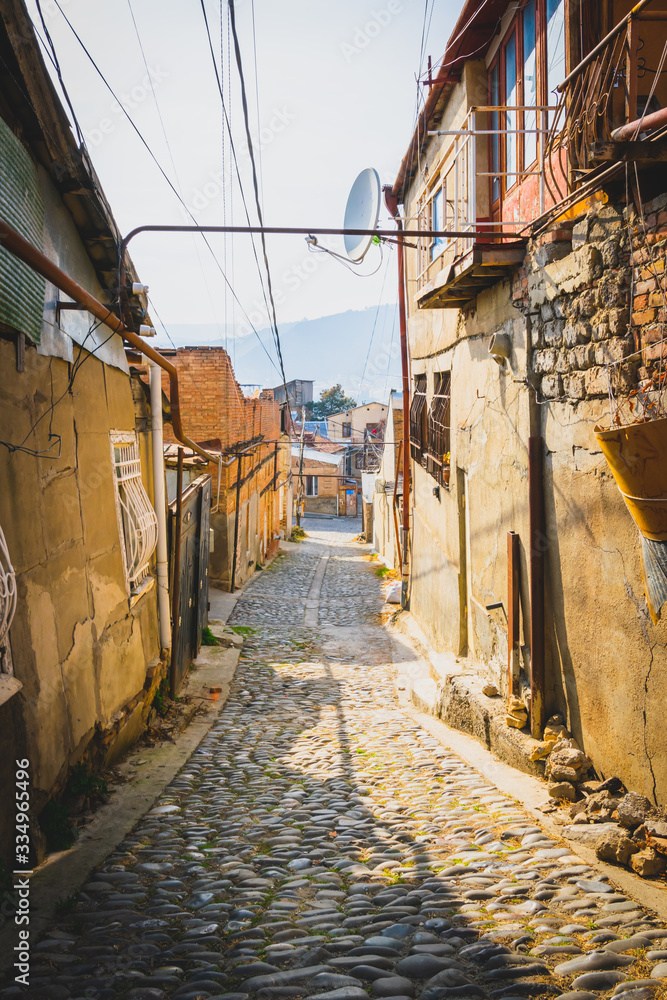 Pathway of traditional narrow georgian roads with rocky ground and old ...