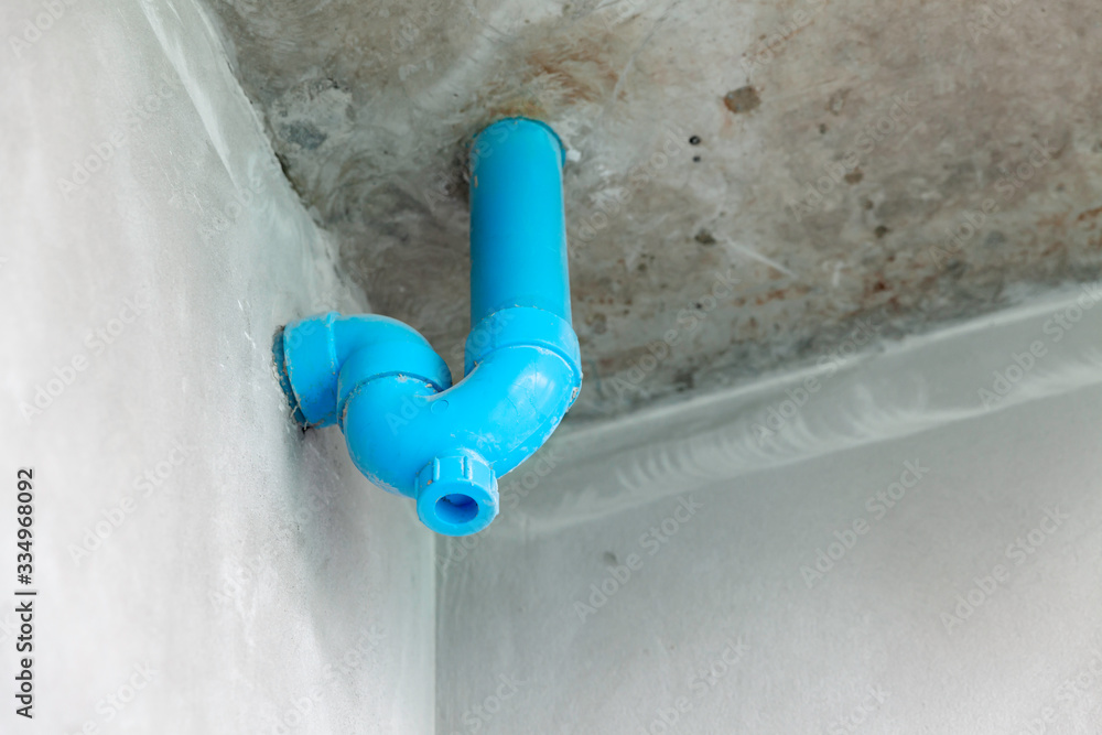 Sewerage pipes inside the building.Blue PVC pipes. Stock Photo | Adobe ...