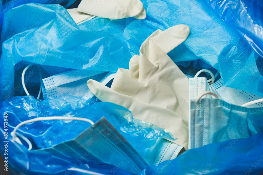Medical trash. Coronavirus protection equipment in medical waste bin ...