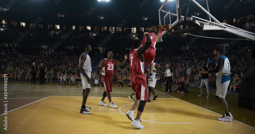 Basketball player scores a goal with splashes and flames animation on a ...