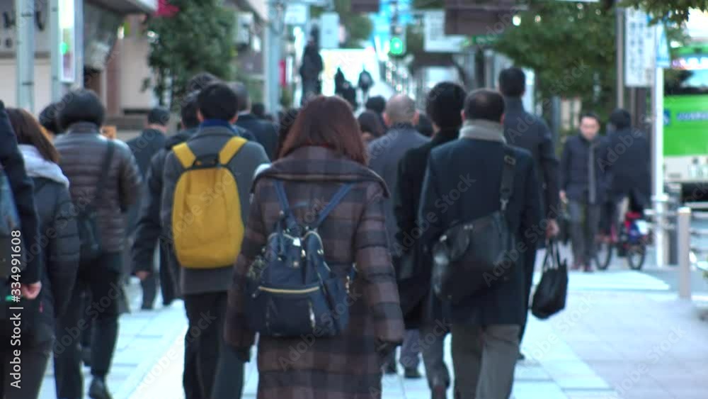 TOKYO, JAPAN - MARCH 2020 : View of crowd of people walking down the ...