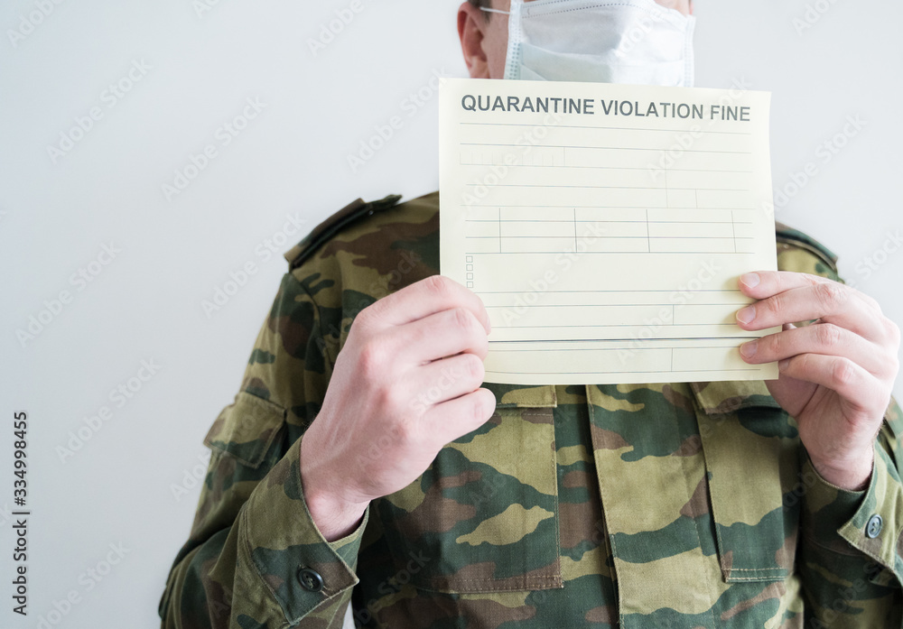 Police officer with handcuffs in khaki colored uniform stops people on ...