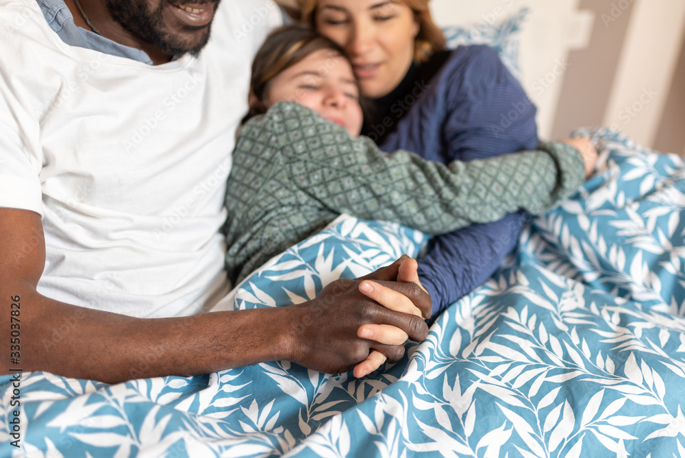 happy mixed race family cuddling, Caucasian mom and African dad hug ...