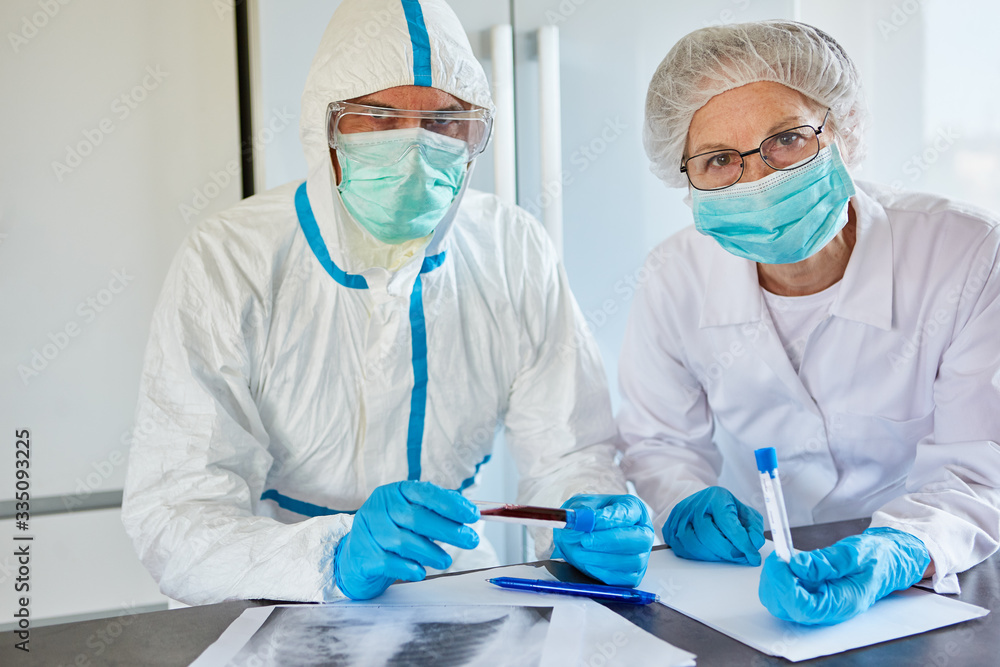 Doctors in clinic treating Covid-19 patients Stock Photo | Adobe Stock