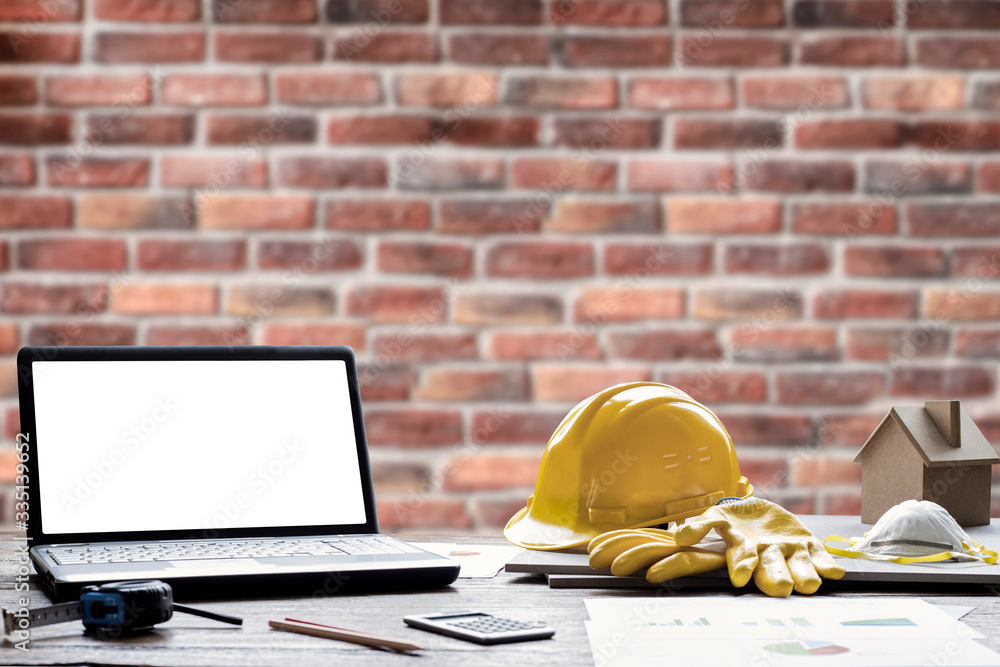 construction worker with laptop Stock Photo | Adobe Stock