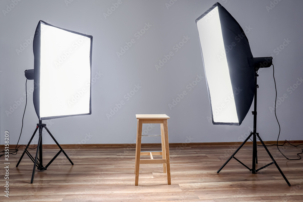 Chair and lighting equipment in modern photo studio Stock 写真 | Adobe Stock
