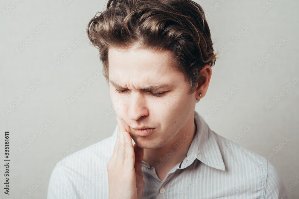 man has a toothache Stock Photo | Adobe Stock