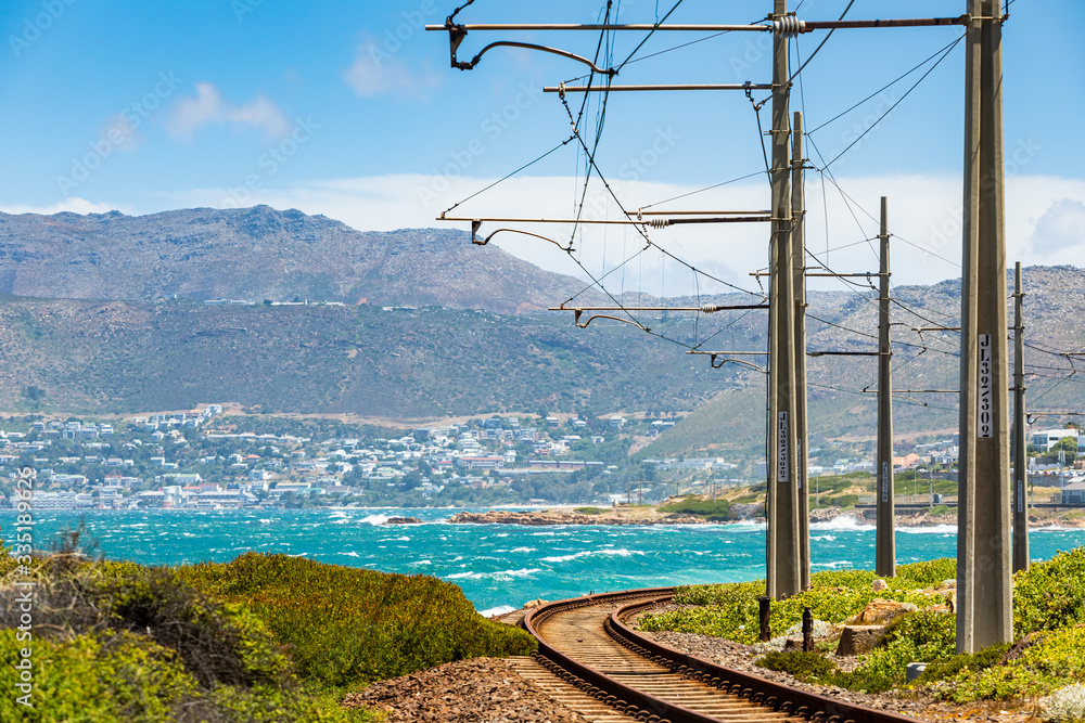 Electric Passenger Railway line on the shoreline of False Bay, Cape ...