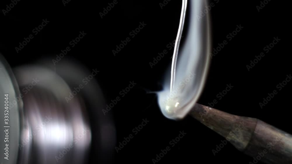 Melted solder wire over a hot soldering iron tip. Stock ビデオ | Adobe Stock