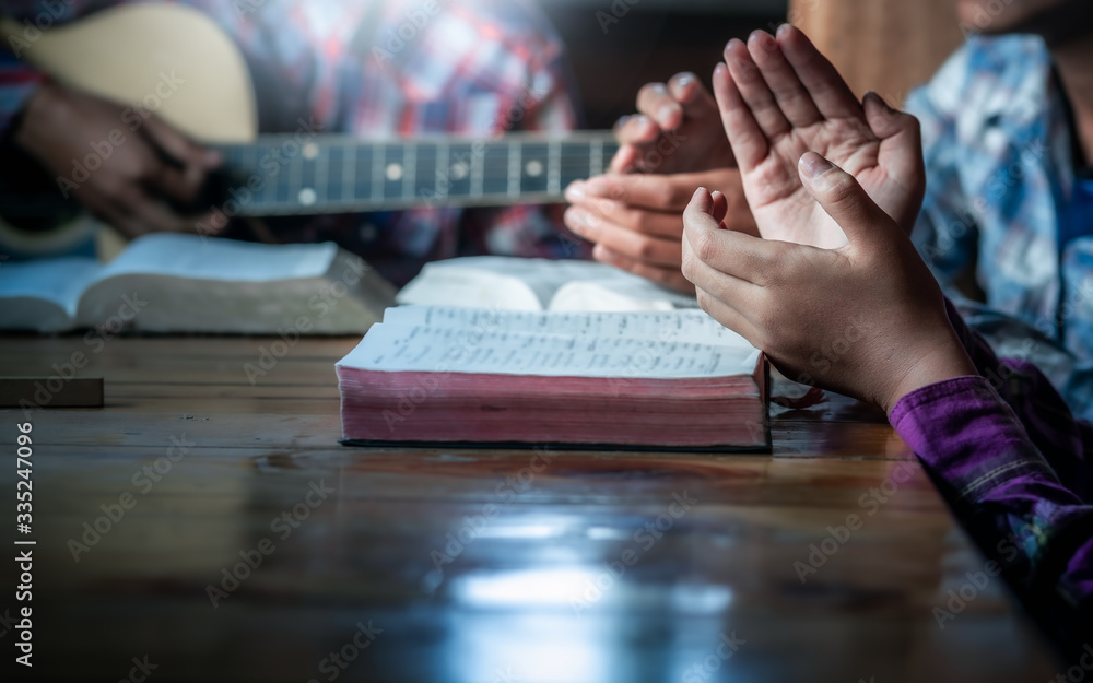 Group of christian sitting while praise and worship God by playing ...