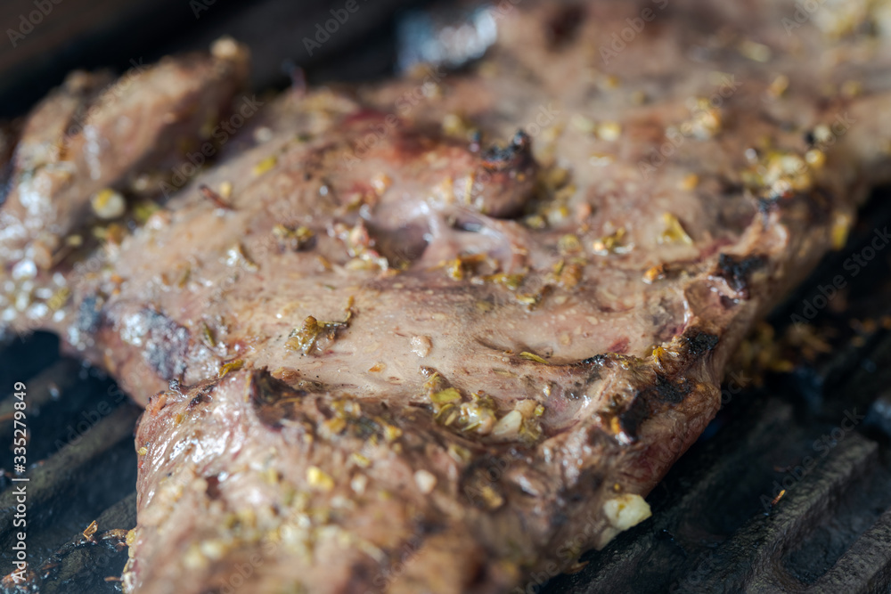 Big piece of marinated beef heart on cast iron grill grate Stock Photo ...